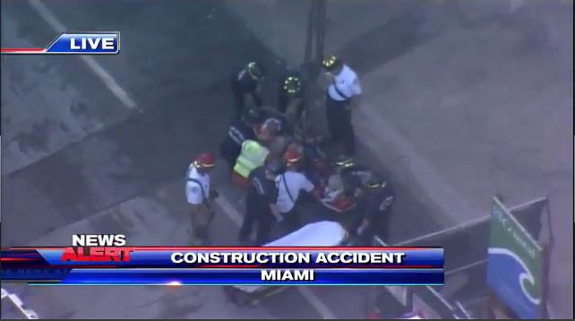 Construction worker pinned under equipment after 12th floor accident ...