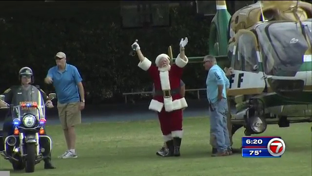 Santa ditches sled, crashes Christmas party by chopper - WSVN 7News ...