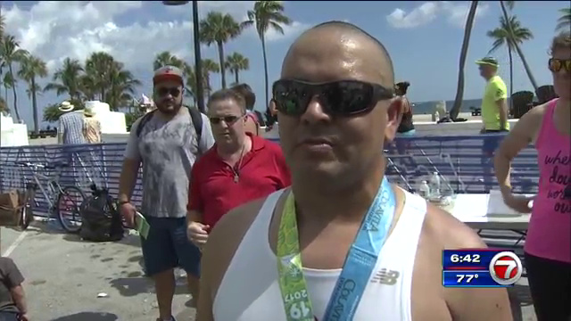 Local firefighter pushes paralyzed dad for entire 26-mile marathon ...