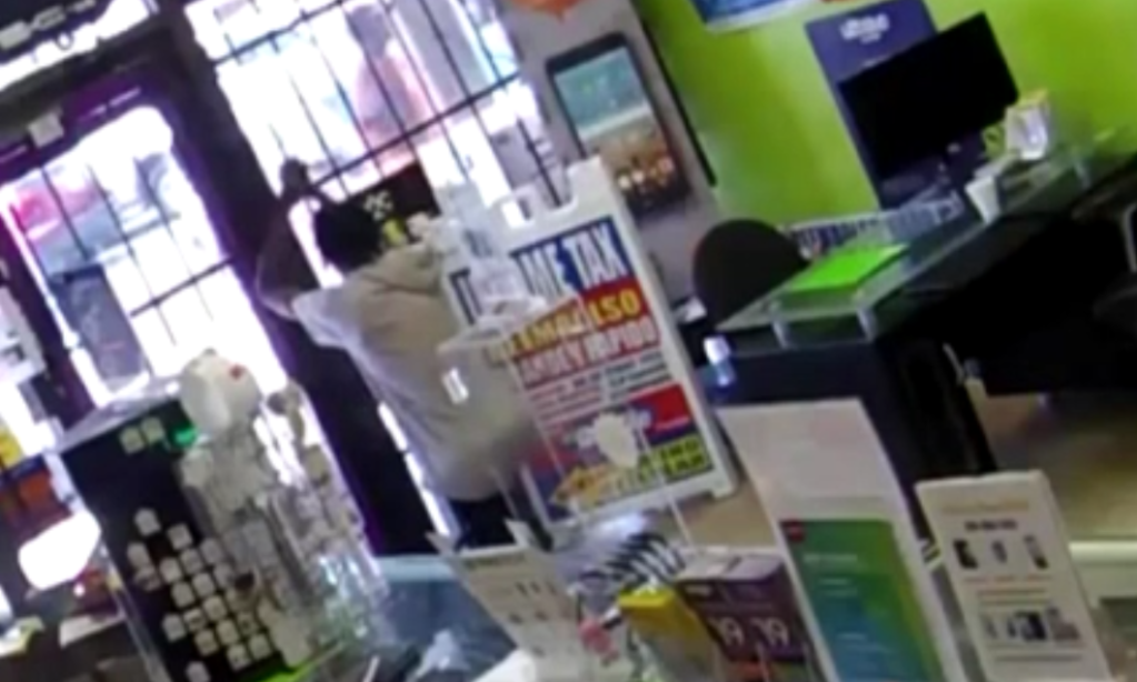 Robber seen praying on security camera after getting locked inside ...
