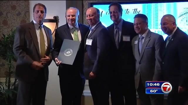 AutoNation CEO recognized for role in Riverwalk District development ...