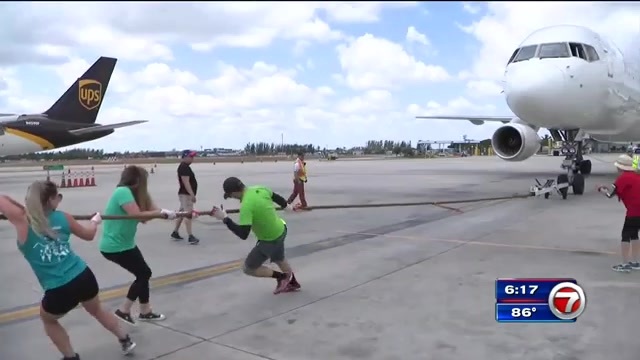 Teams compete in pulling UPS jet farthest in United Way challenge ...
