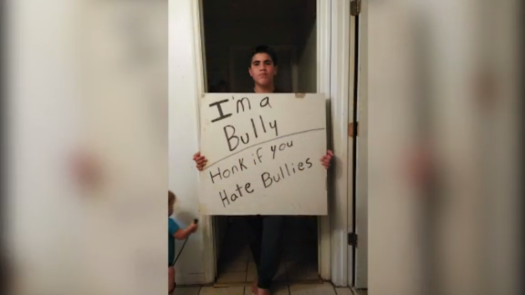 Dad forces son to hold ‘I’m a bully’ sign after learning he bullied ...