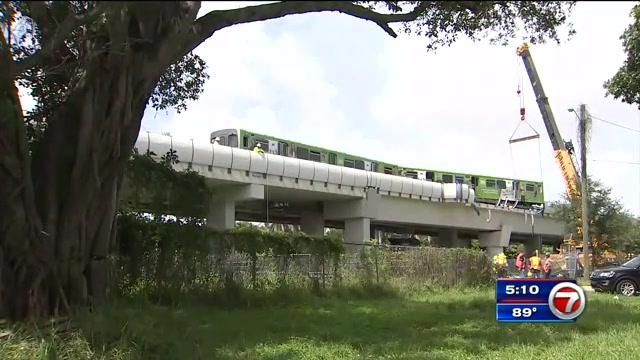 Crews working on Metrorail train car after partial derailment in NW ...