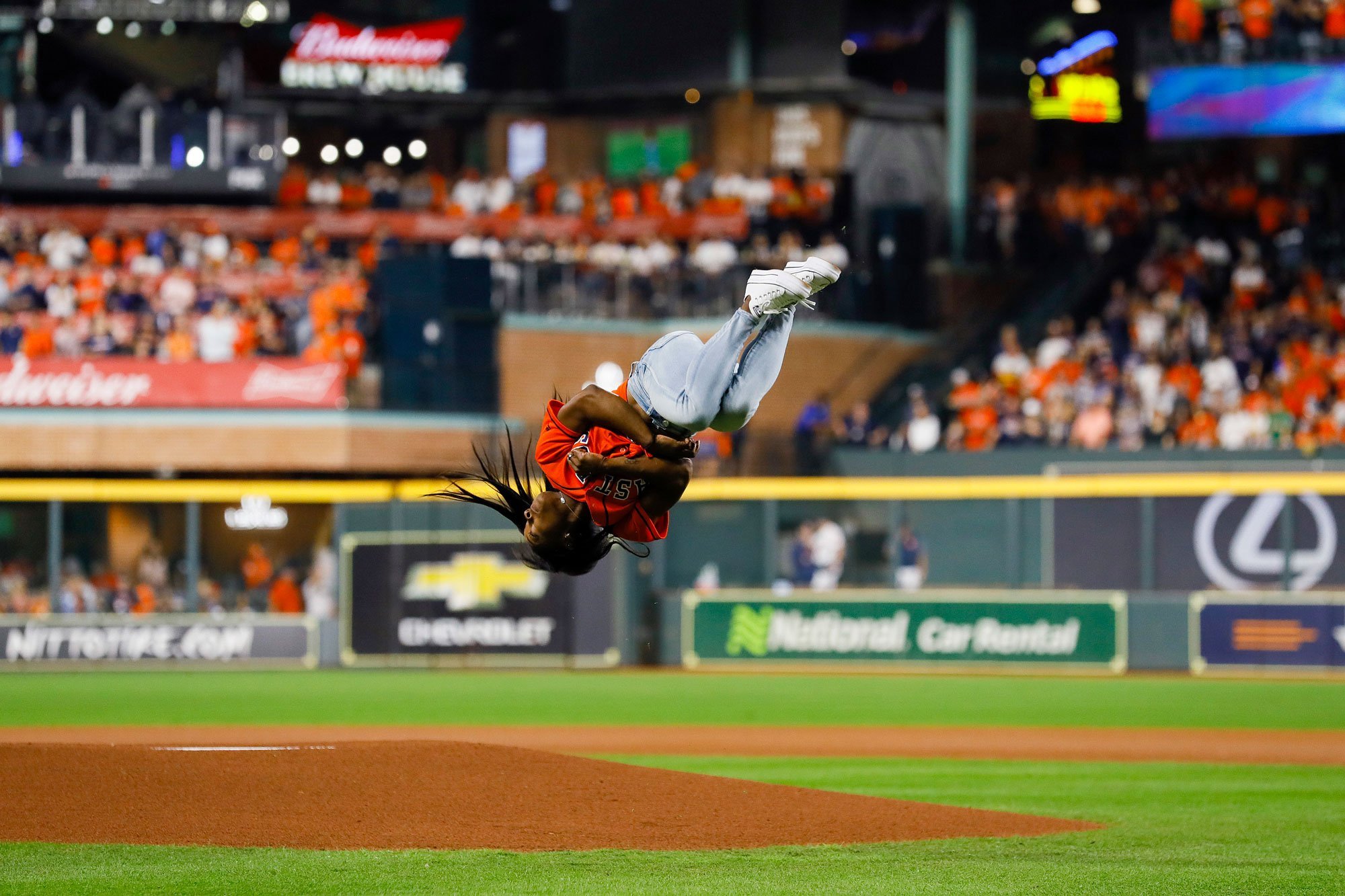Simone Biles does flip before throwing first pitch during the World ...
