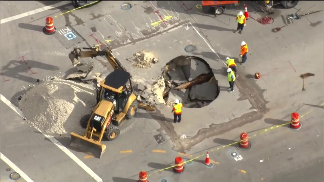 Crews repair water main break that caused hole in street in Miami ...