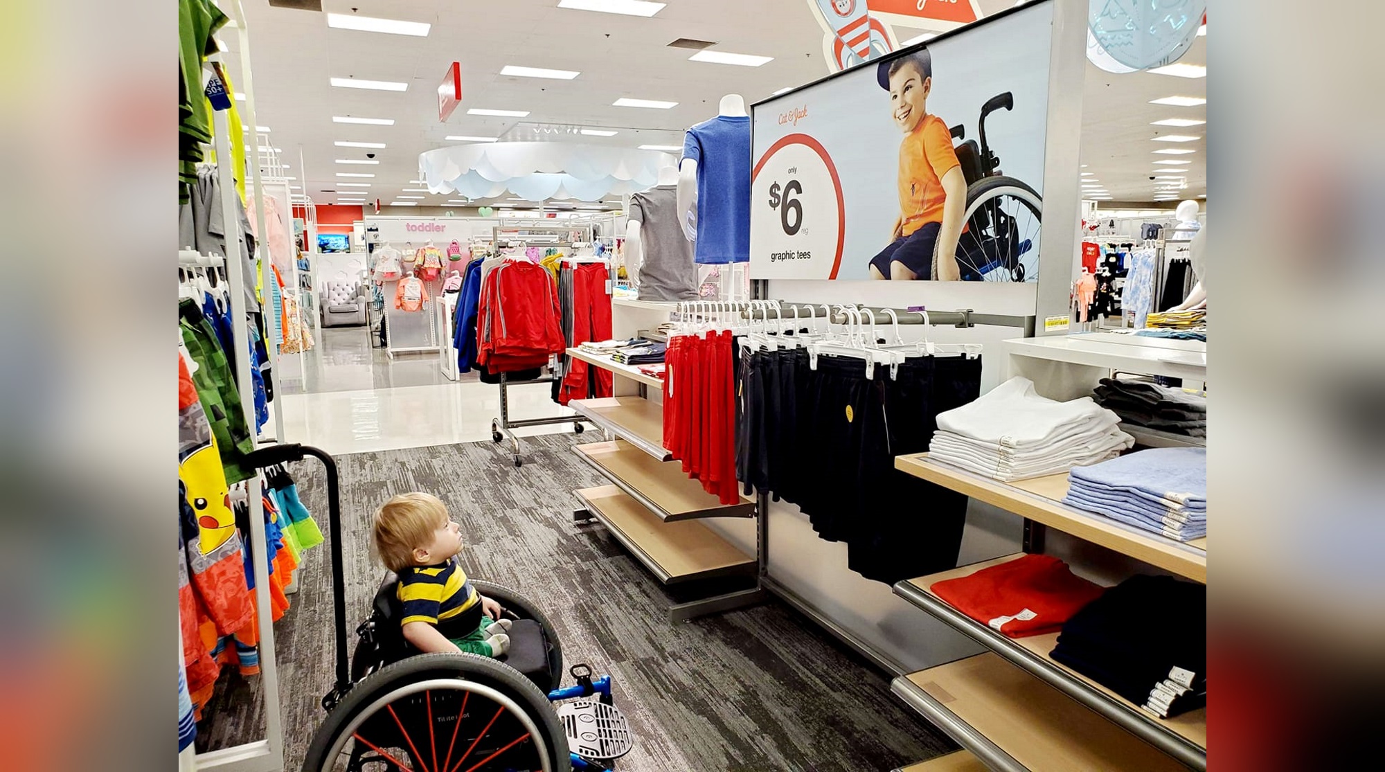 Photo shows 2-year-old in wheelchair in awe when seeing Target ad with ...
