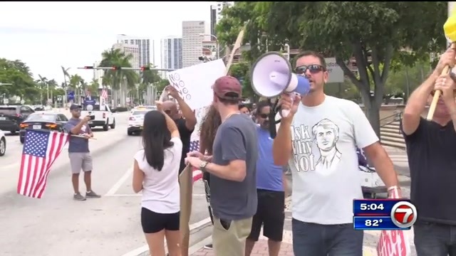 Protesters in downtown Miami call for lifting of all restrictions amid ...