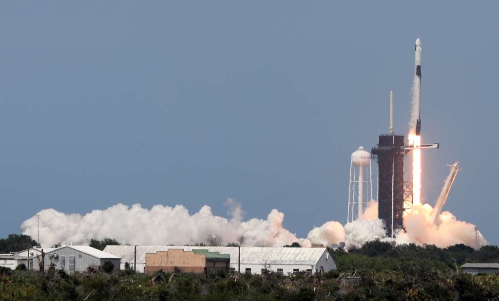 Astronauts aboard SpaceX’s Crew Dragon dock with International Space ...