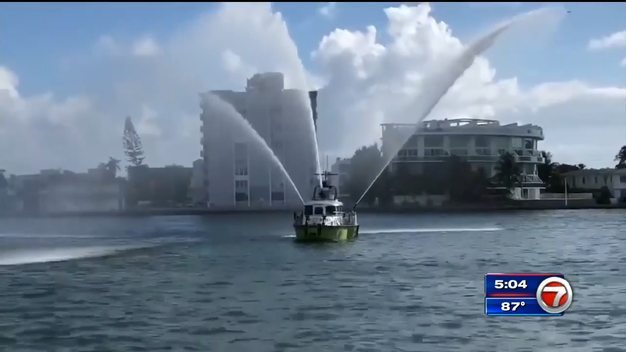 Miami-Dade firefighters spray water from fire boats to help oxygenate ...