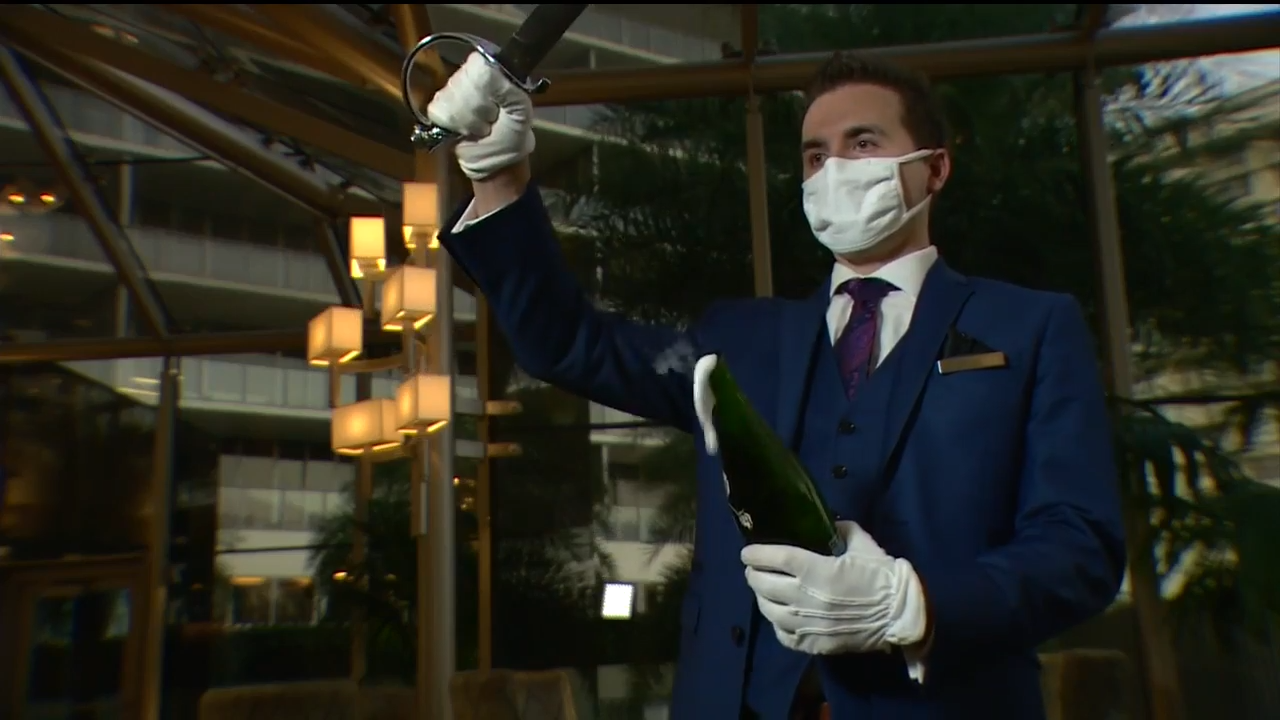 Butler at St. Regis Hotel in Bal Harbour opens champagne bottles with ...