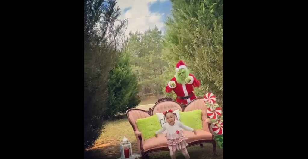 Child runs away in fear after Grinch surprises her during photo shoot ...