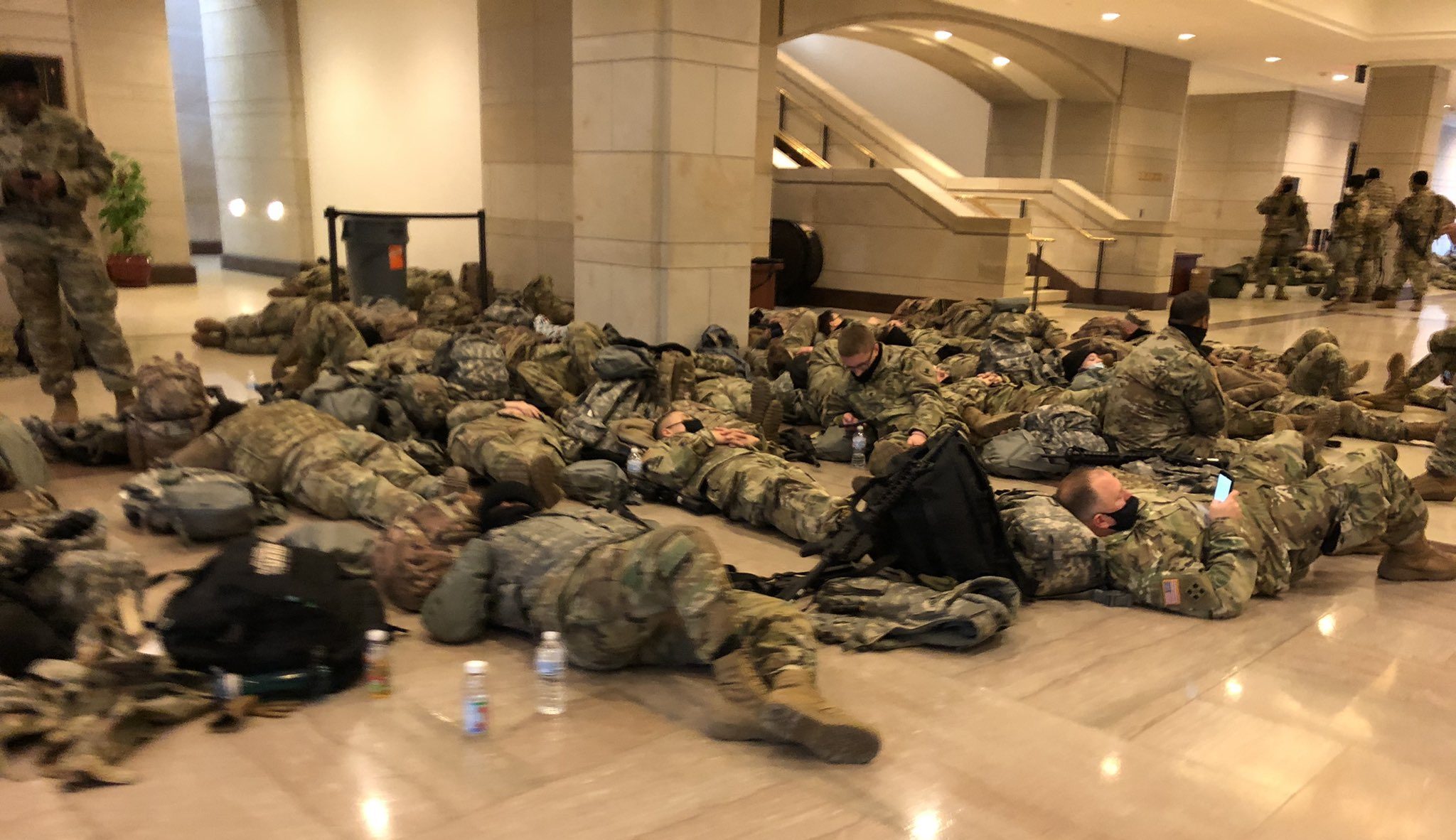 Exhausted National Guard troops rest on Capitol floor after working ...