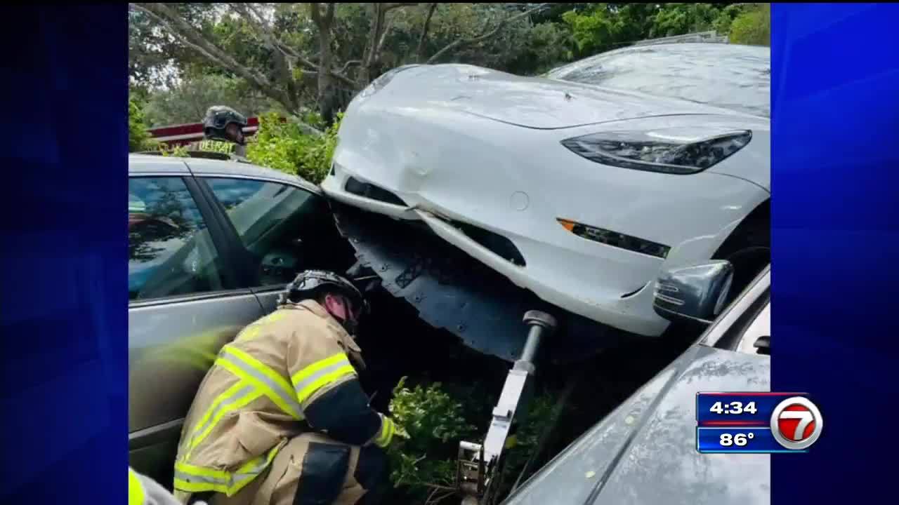 Tesla lands on top of 2 parked cars in Delray Beach; no injuries - WSVN ...