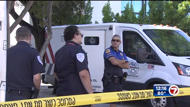Armored truck driver in distress transported; bullet hole seen in ...