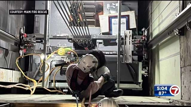 Rescuers use harnesses to pull 3 from stuck elevator at Government ...