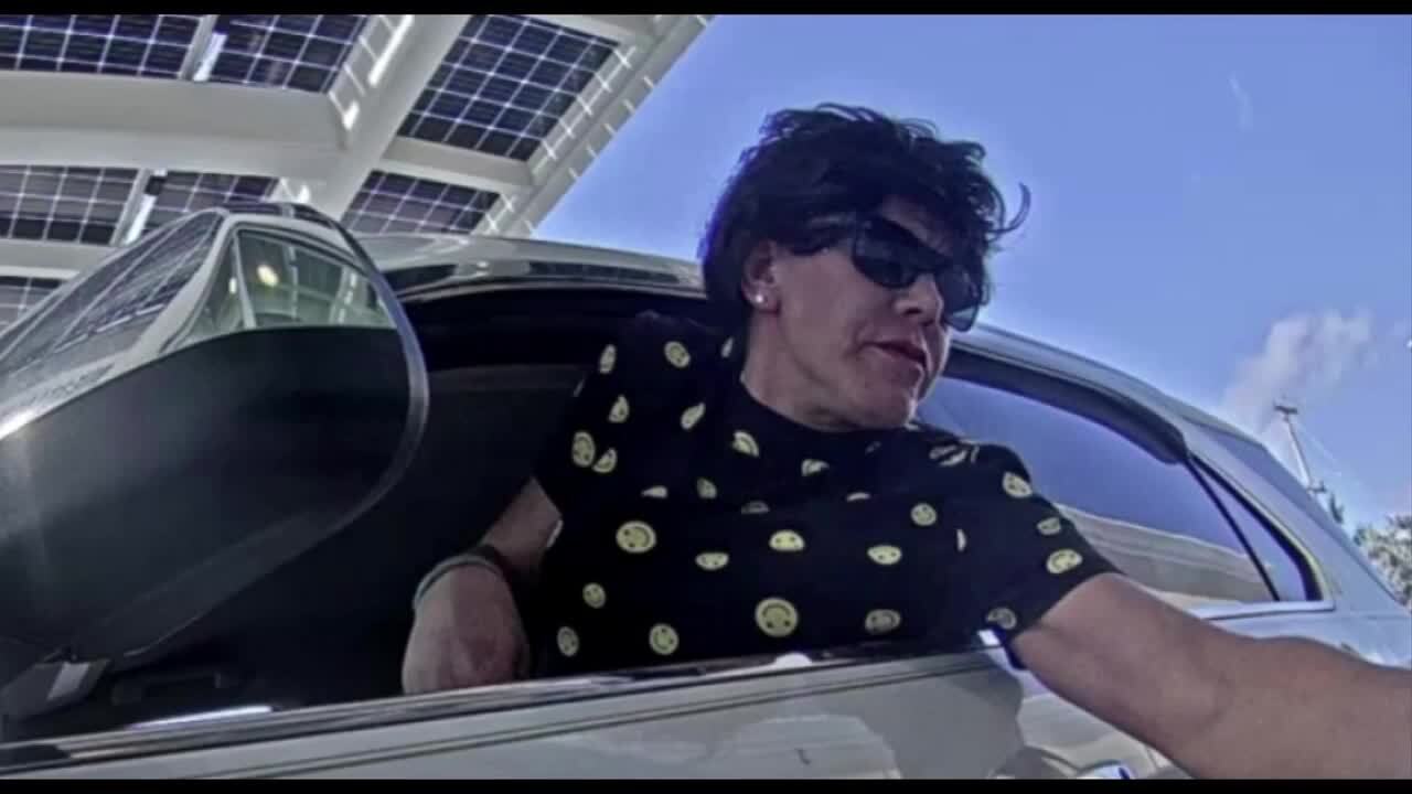 Woman caught on bank drive-thru camera with puppy in her lap cashing ...