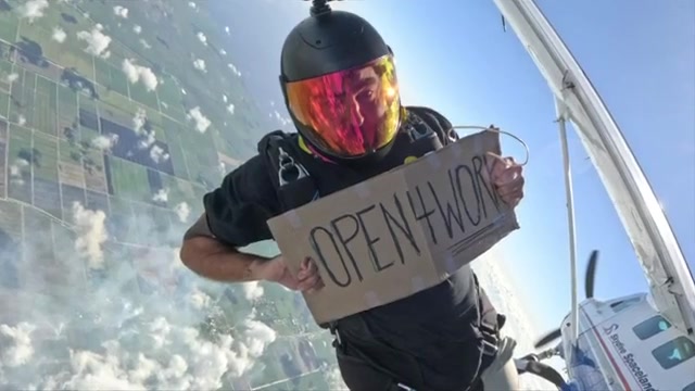 Fort Lauderdale man sky dives with ‘Open 4 work’ sign, lands new job ...