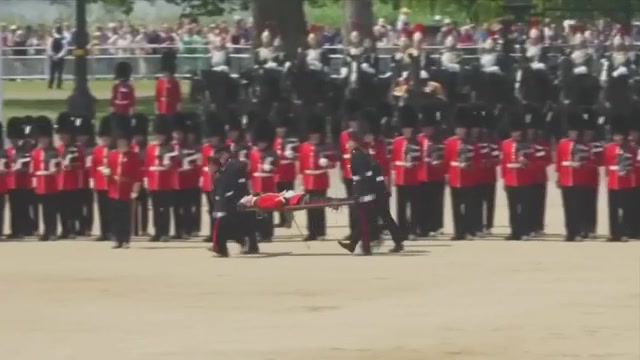 Troops feel the heat, and several faint, as Prince William reviews ...