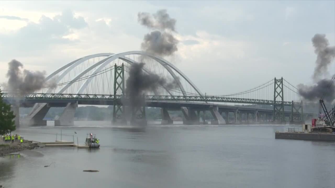 Parts of bridge that connects Iowa and Illinois comes down with help of ...