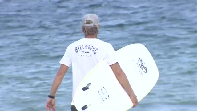 Surf instructor, off-duty lifeguards rush to save submerged swimmer off ...