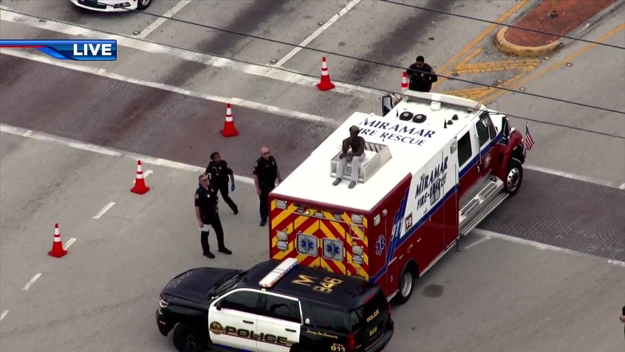 Police standoff ends after man climbs down from fire rescue truck in ...
