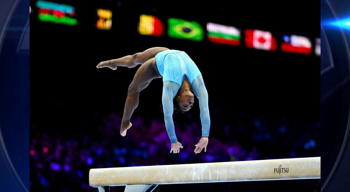 Simone Biles makes history on opening day of qualifying at World ...