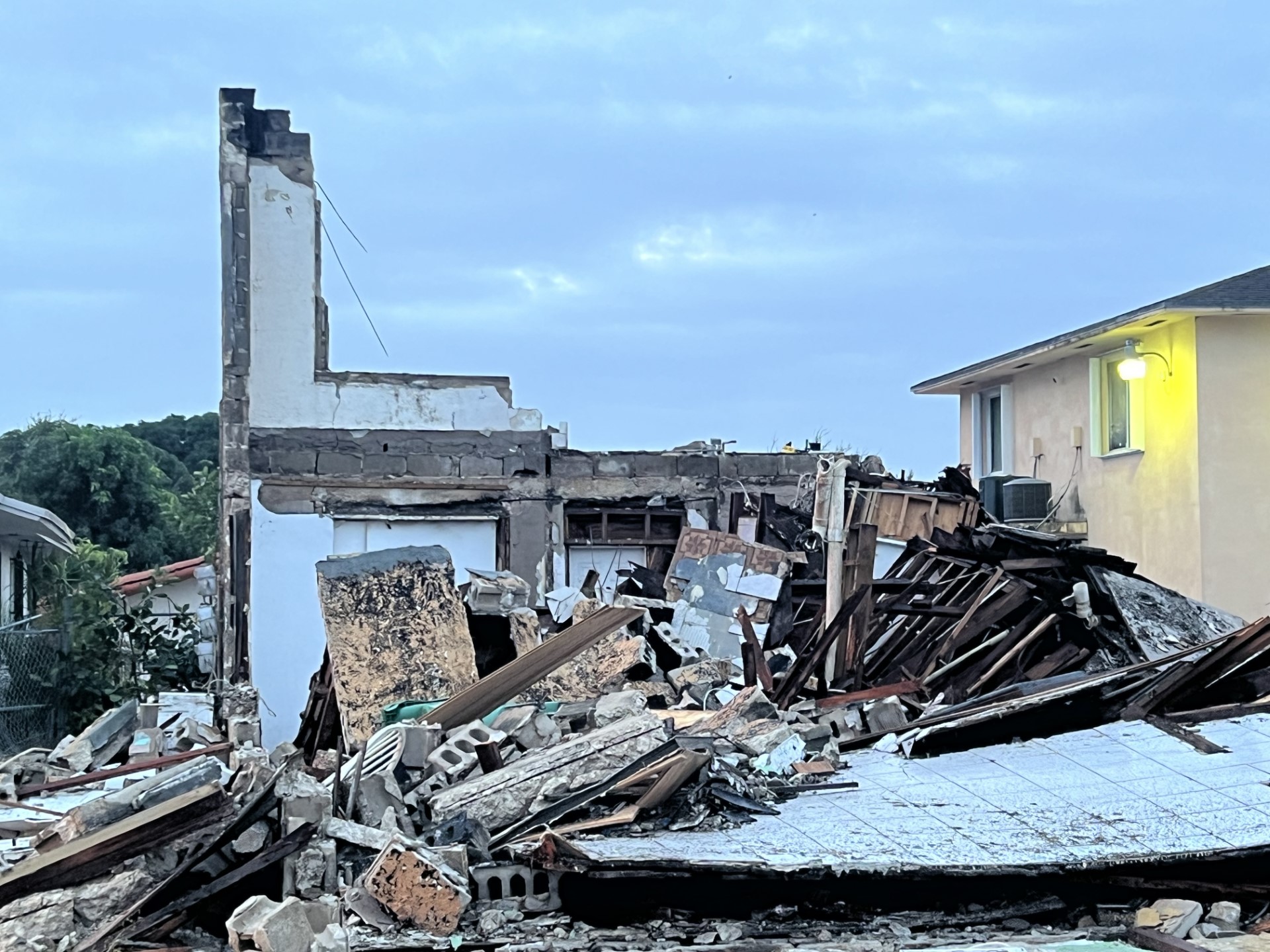 Family displaced after abandoned structure collapses, falls onto home ...