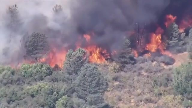 Firefighters helped by cooler weather battle blaze that has scorched ...
