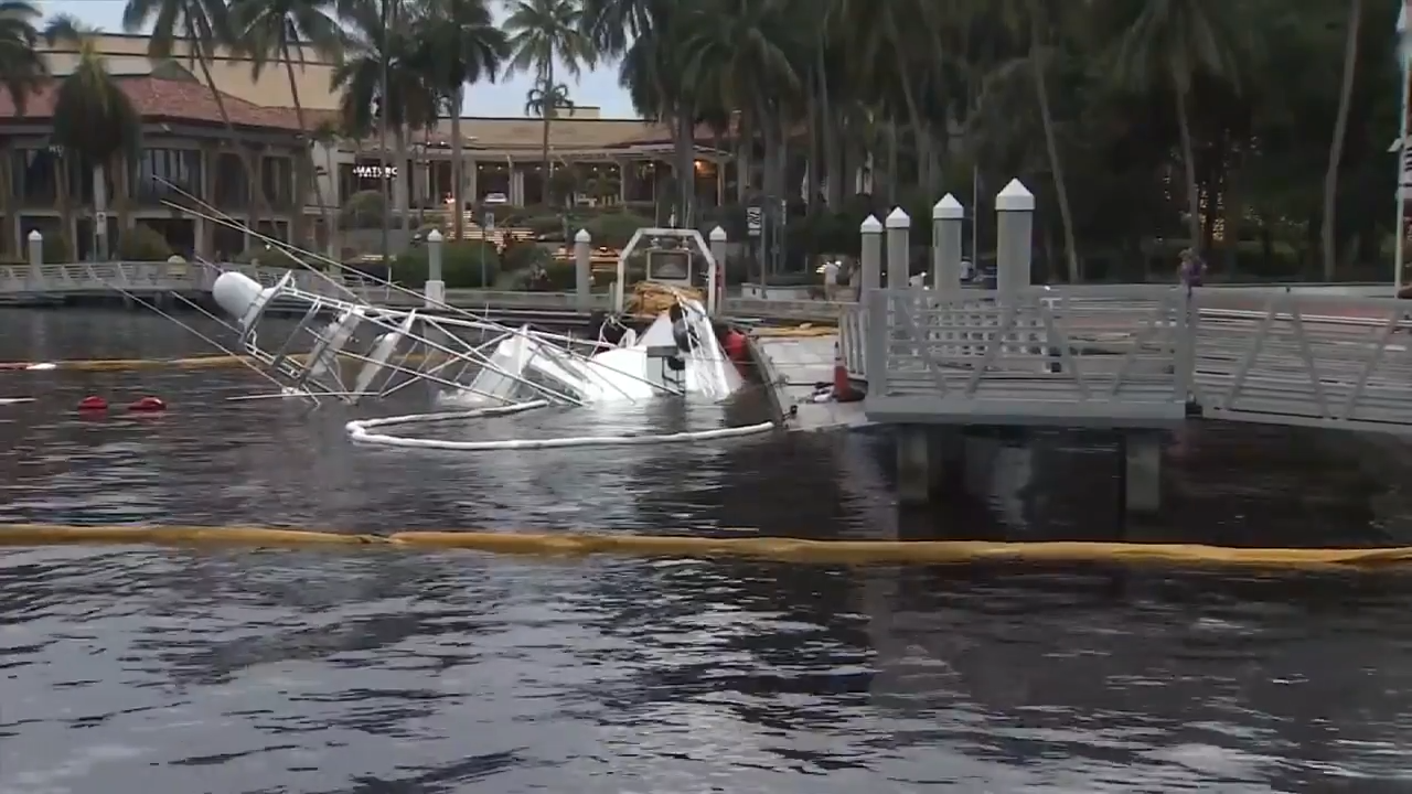 70-foot yacht partially submerged in New River near Esplanade Park in ...