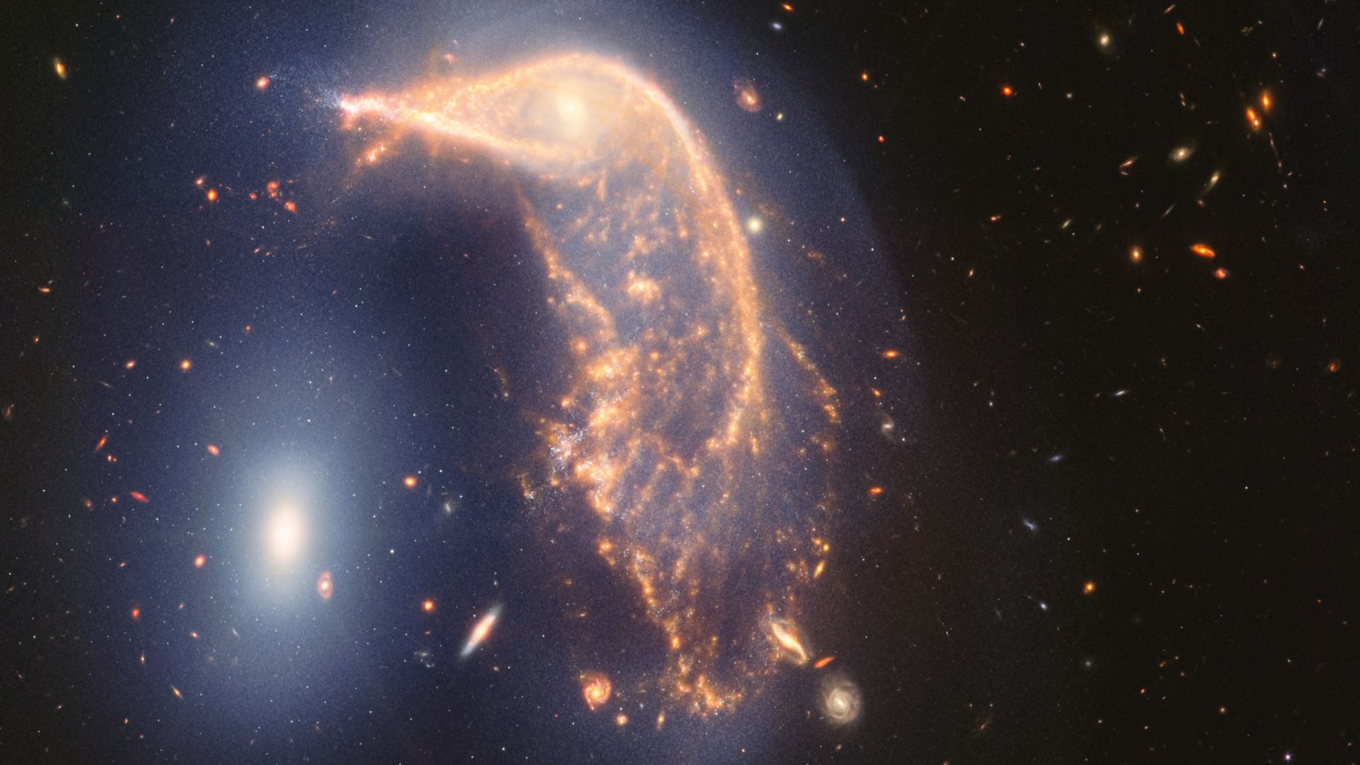 Webb Space Telescope’s latest cosmic shot shows pair of intertwined ...