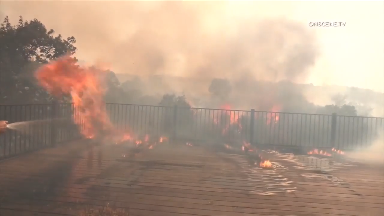 Wildfires plague the West amid a scorching heat wave. Homes burn in ...