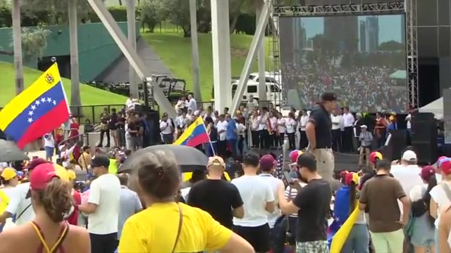 About 100 people rally for Venezuelan opposition in Bayfront Park amid ...