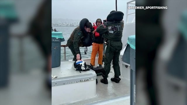 Navy crew members eject from their jet before it crashes off the San ...