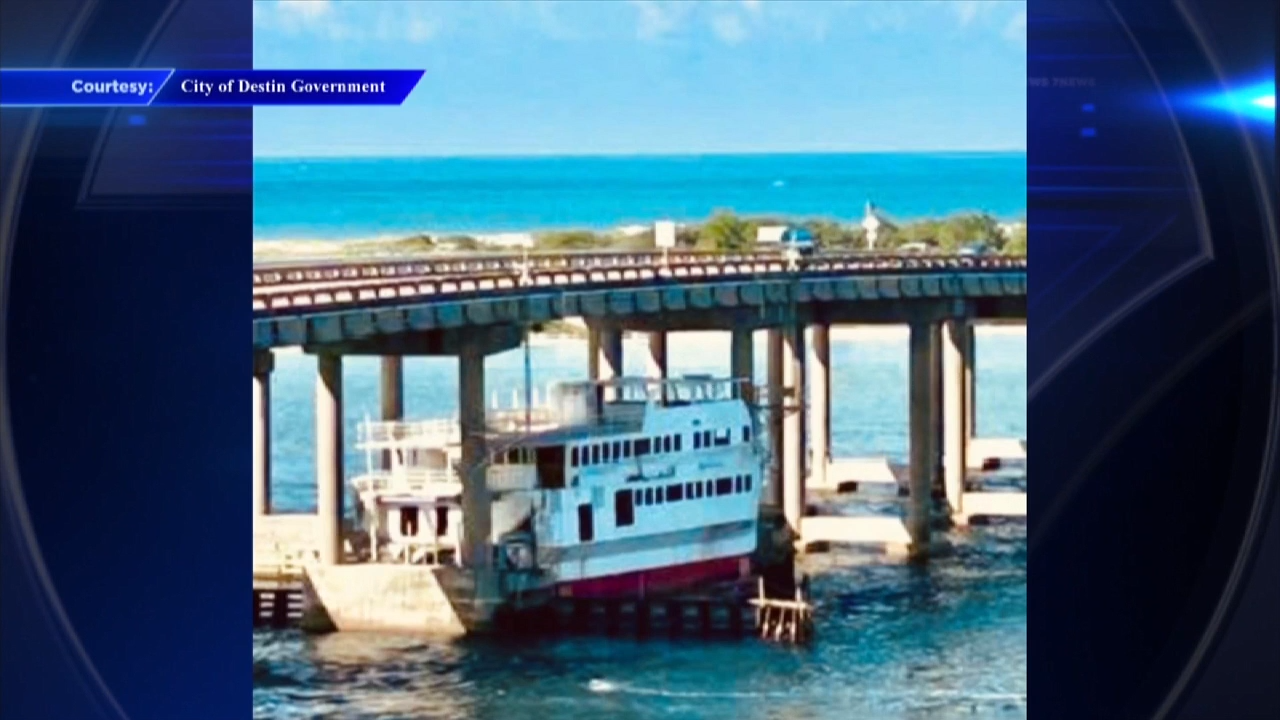 Boat set to become artificial reef gets wedged between bridge towers ...