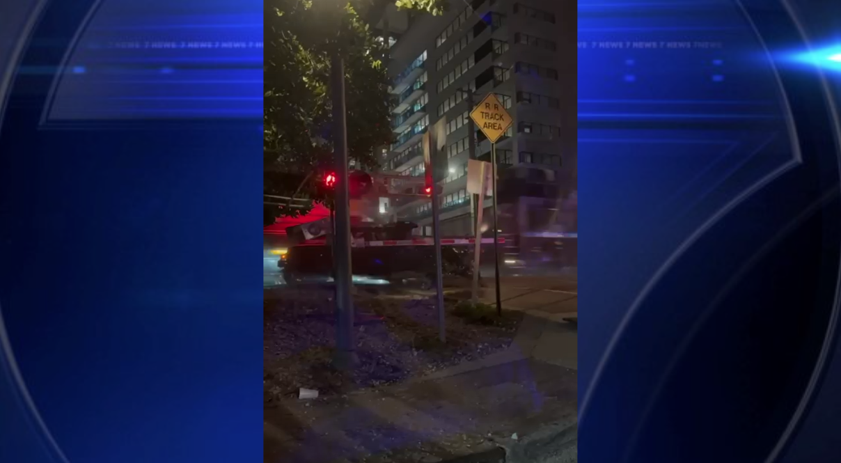 Woman hospitalized after train hits truck, 2 cars collide near The Den ...
