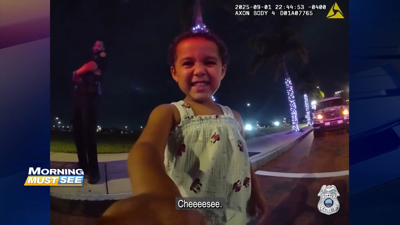 ‘Say cheese’: Viral video shows young girl using Tampa police officer’s ...
