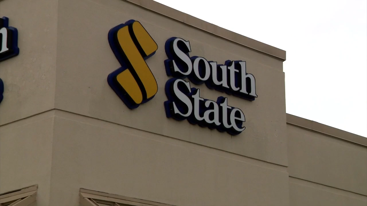 Man arrested for trying to cash $25K check acquired through phone scam ...