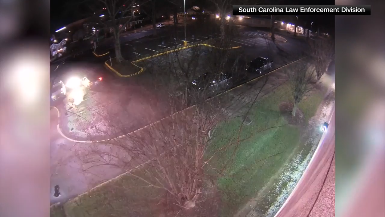 Surveillance video shows police officer ambushed in patrol car - WSVN ...