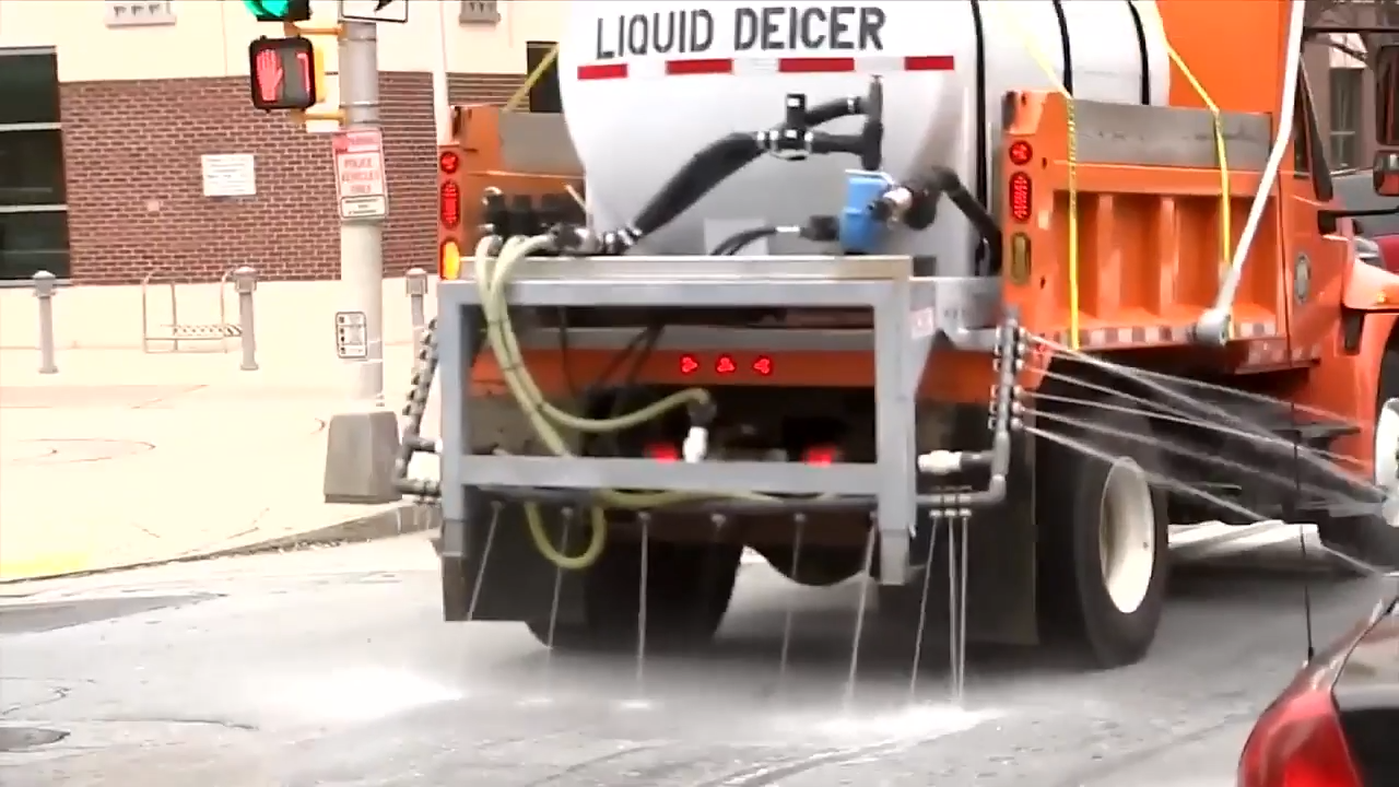 Crews spread salt on roads and people stock up on batteries as a winter ...