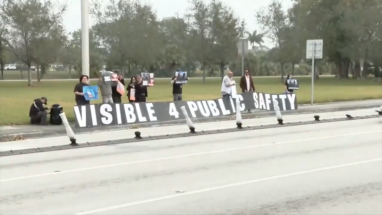 Supporters of Visible Act gather in front of State Sen. Alexis ...