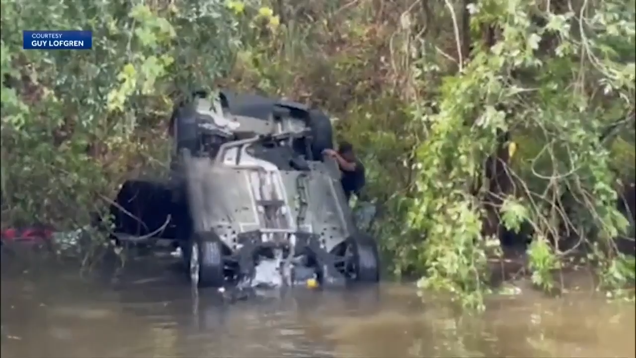 Witnesses rescue driver and passenger from car thar flipped into Fort ...
